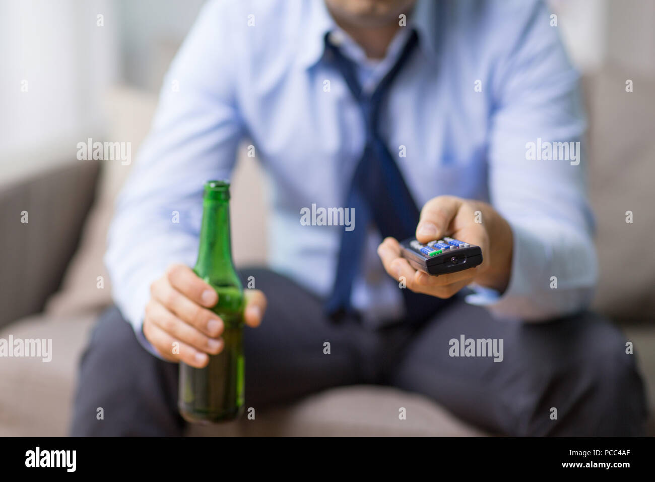 Tv remote hand hi-res stock photography and images - Alamy