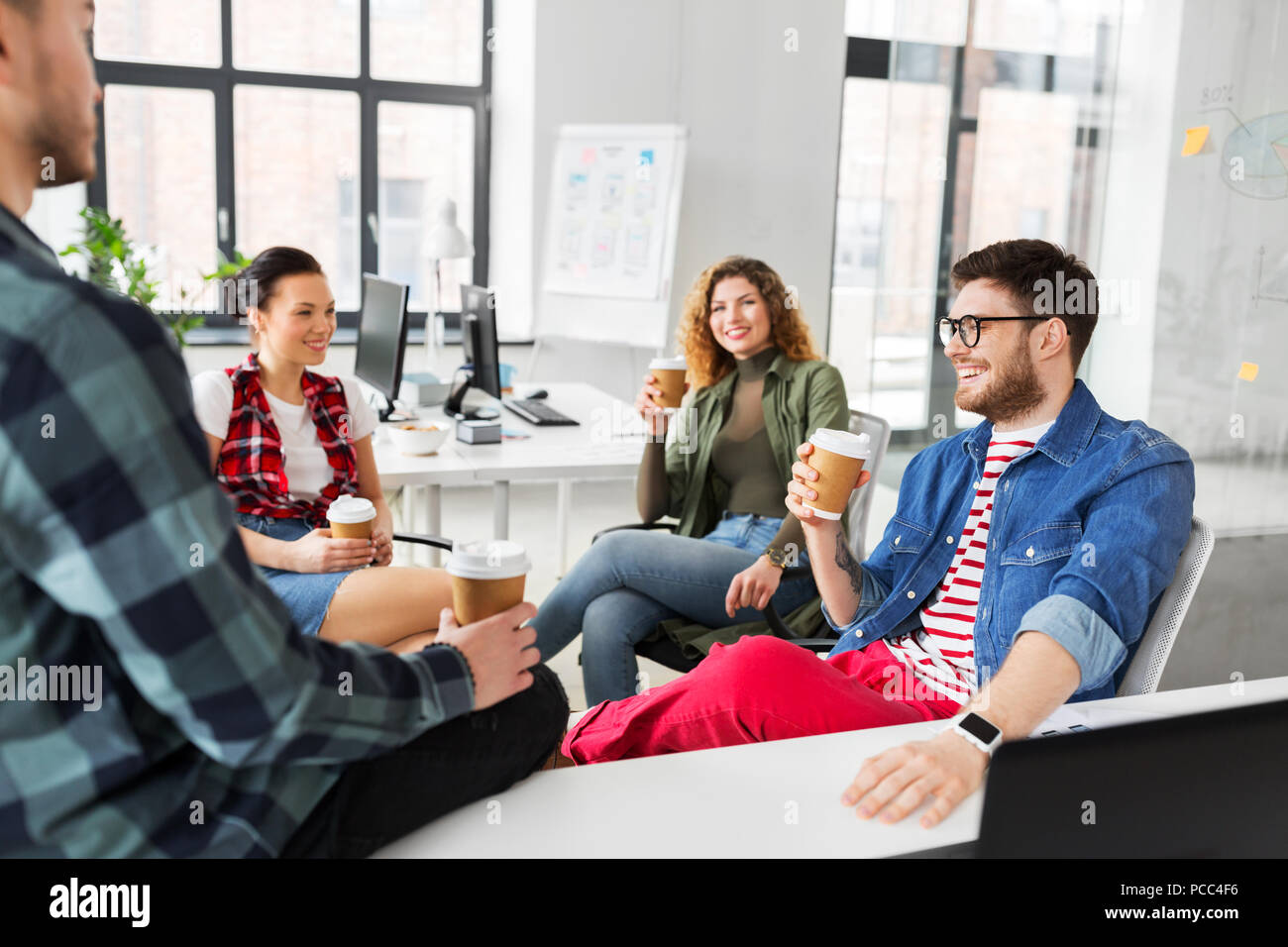 creative team drinking coffee at office Stock Photo - Alamy