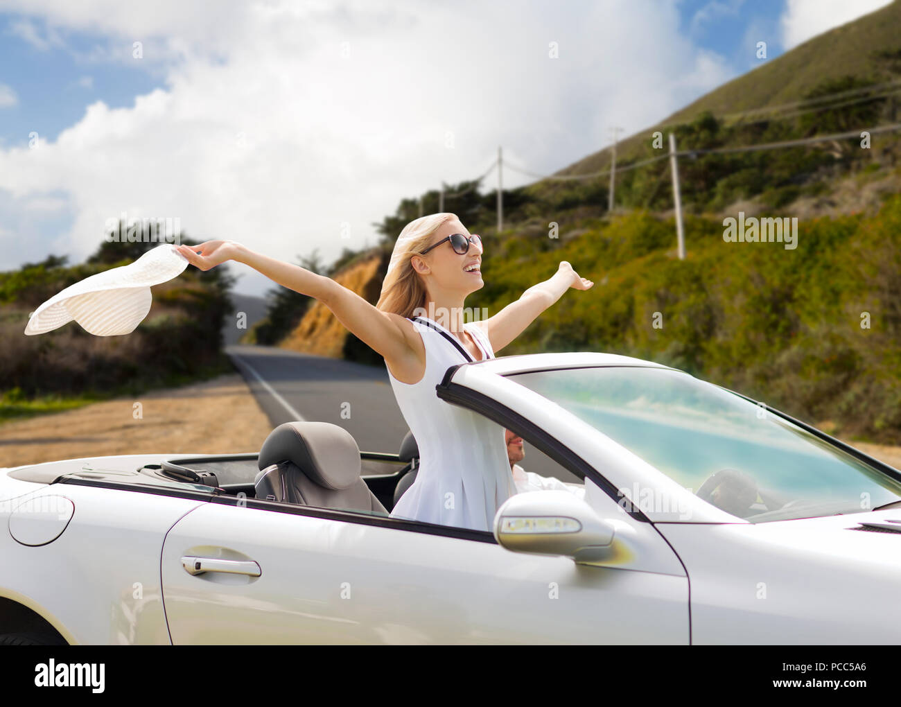 happy couple driving in convertible car Stock Photo - Alamy