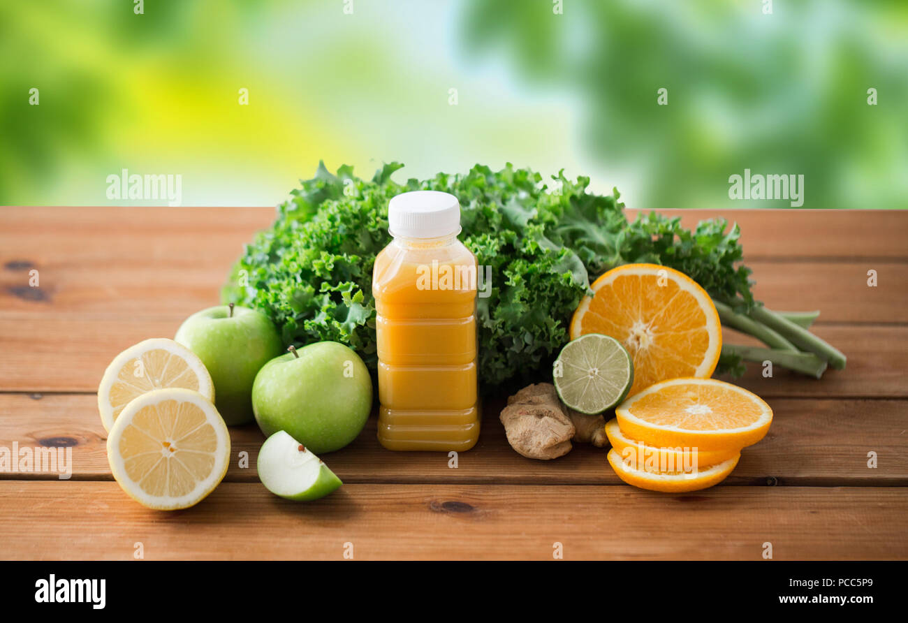 bottle with orange juice, fruits and vegetables Stock Photo - Alamy