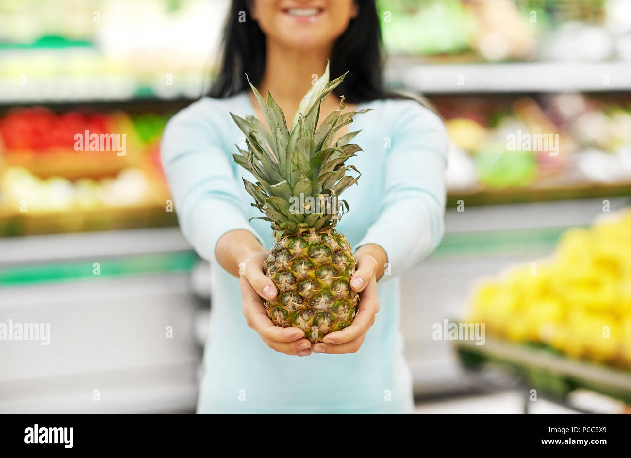 Buying pineapple hi-res stock photography and images - Alamy