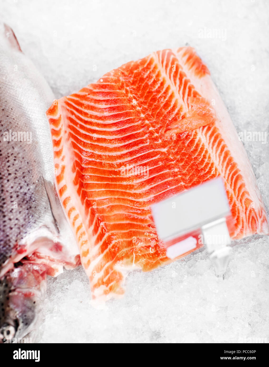 salmon fish fillet on ice at grocery Stock Photo - Alamy