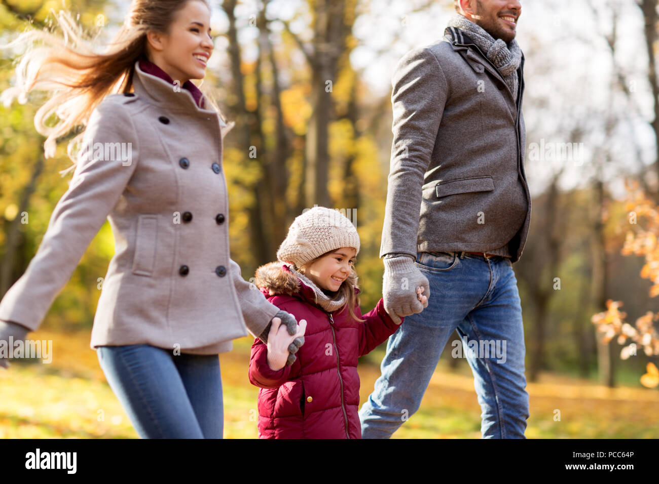 happy family walking at autumn park Stock Photo - Alamy