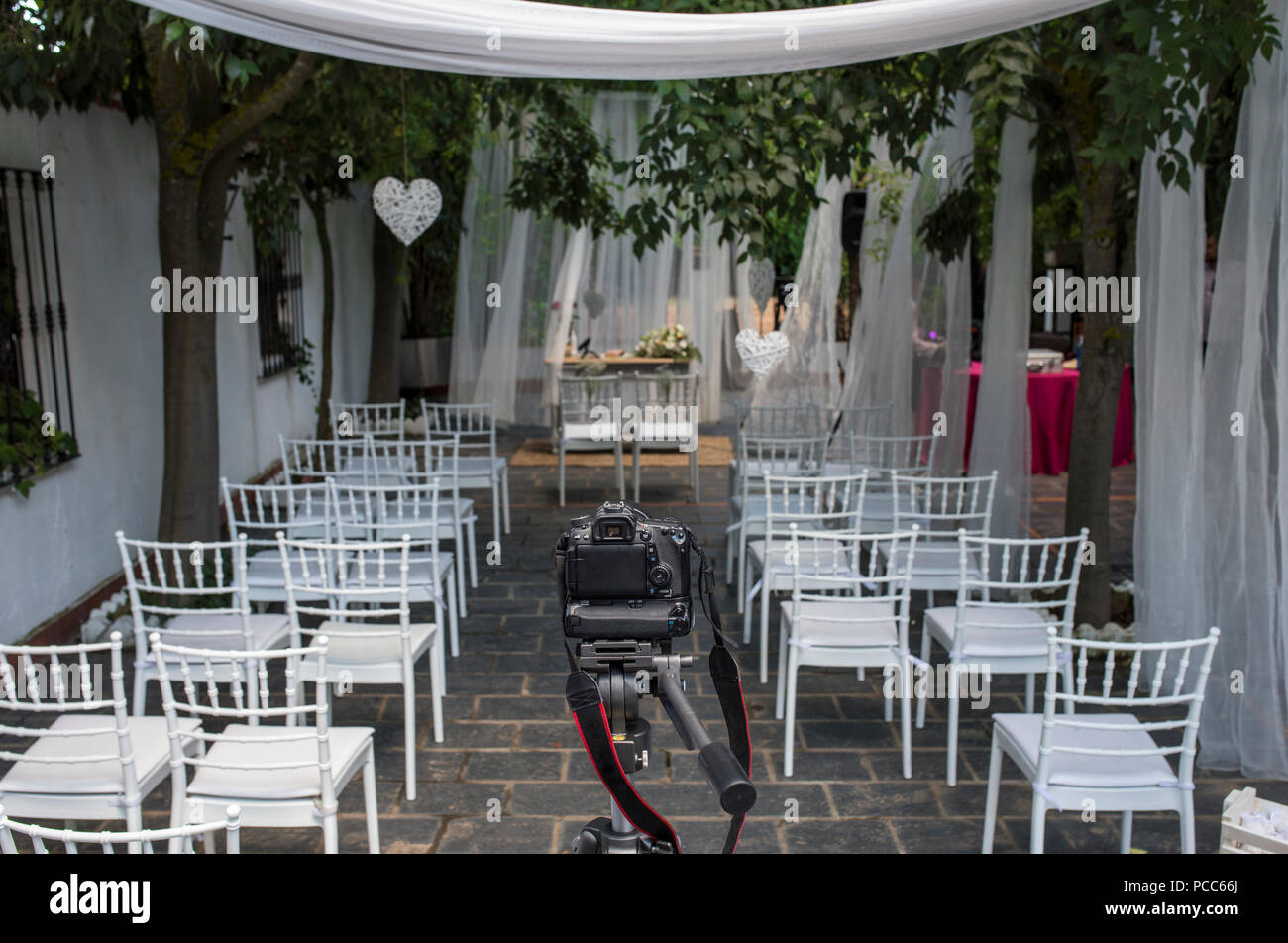 DSLR camera mounted over tripod ready for record wedding. Wedding ...