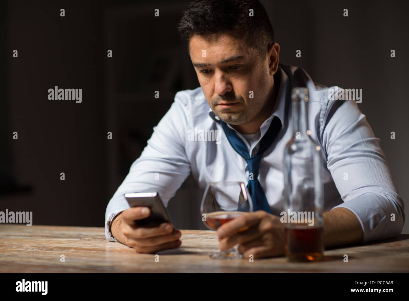 Drunk man mobile phone hi-res stock photography and images - Alamy
