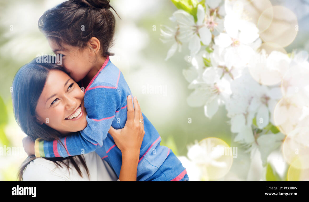 happy mother and daughter hugging and kissing Stock Photo - Alamy