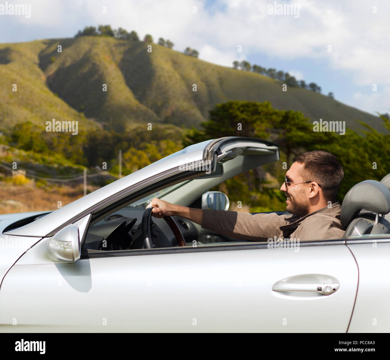 happy man driving convertible car Stock Photo - Alamy
