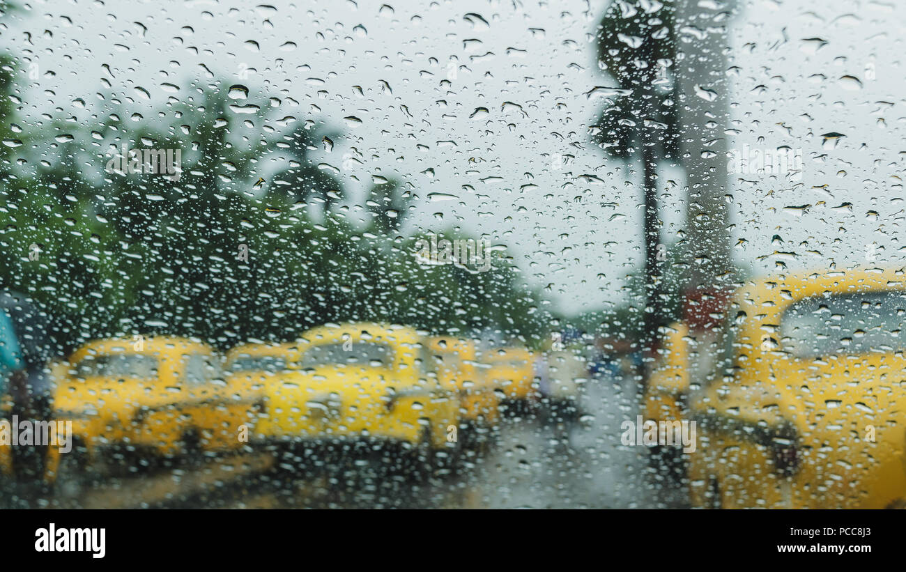 Raindrops falling on glass, abstract blurs - monsoon stock image of ...