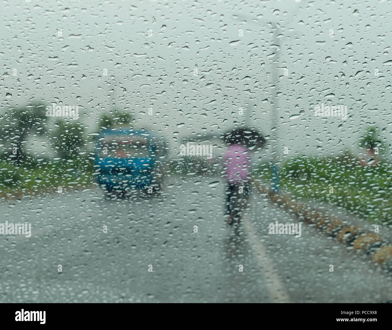 Raindrops falling on glass, abstract blurs - monsoon stock image Stock ...