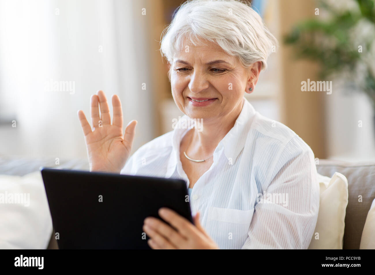 Old woman talking video chat hi-res stock photography and images - Alamy