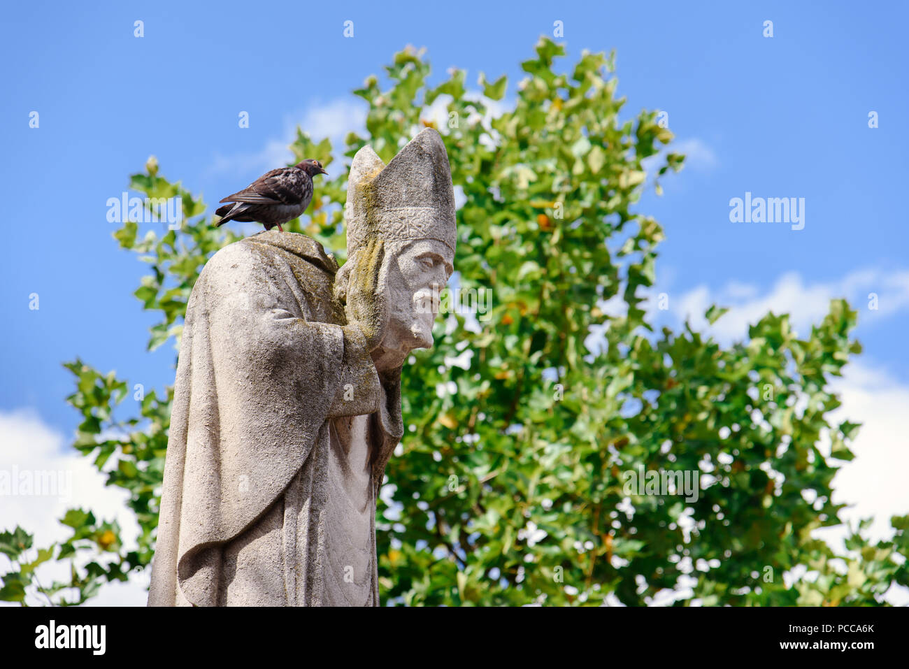 Statue of Saint Denis Holding his Head Stock Photo - Alamy