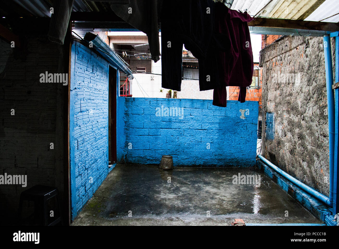 Worn poor concrete and orange brick houses of a favela in San Paolo ...