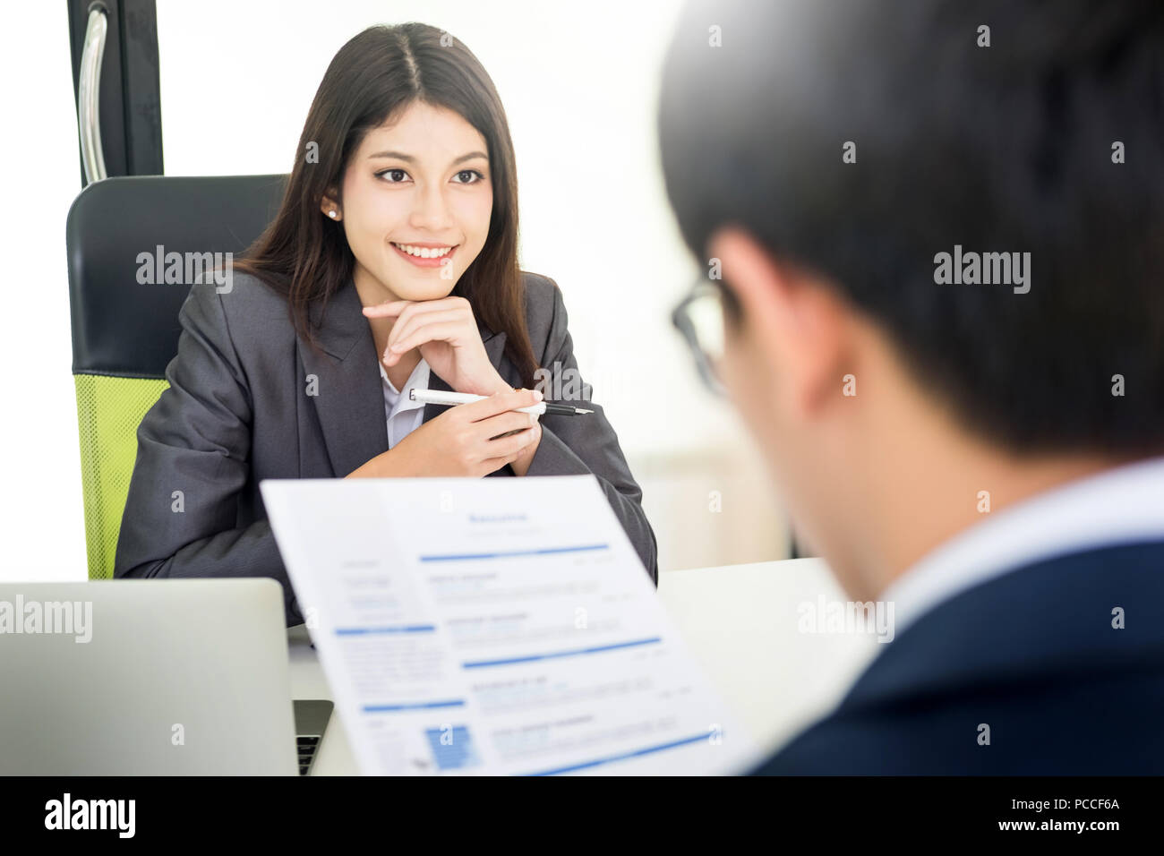 Female Manager conducting a job interview with female applicant looking ...