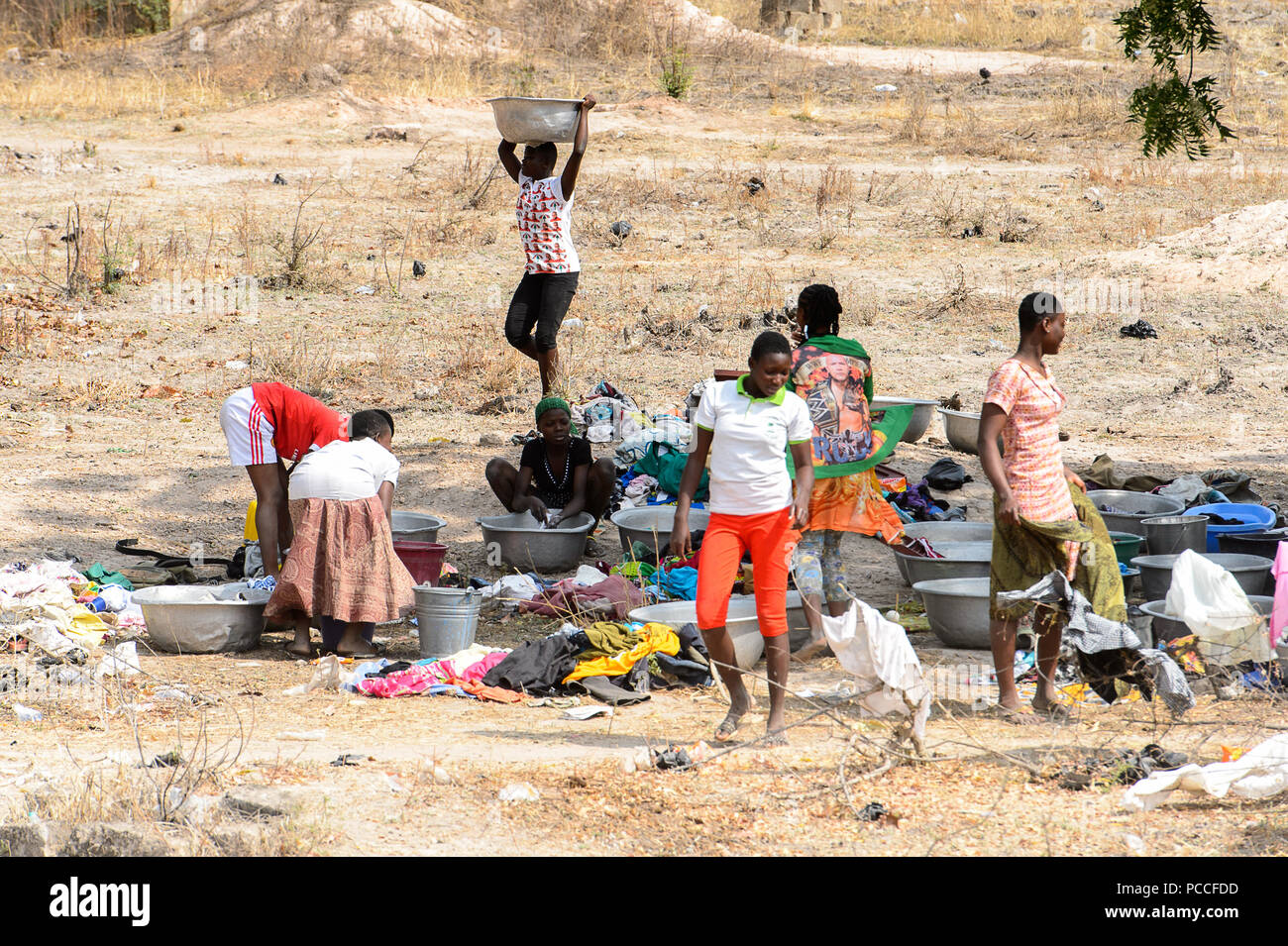 TECHIMAN, GHANA - JAN 15, 2017: Unidentified Ghanaian people clean the ...