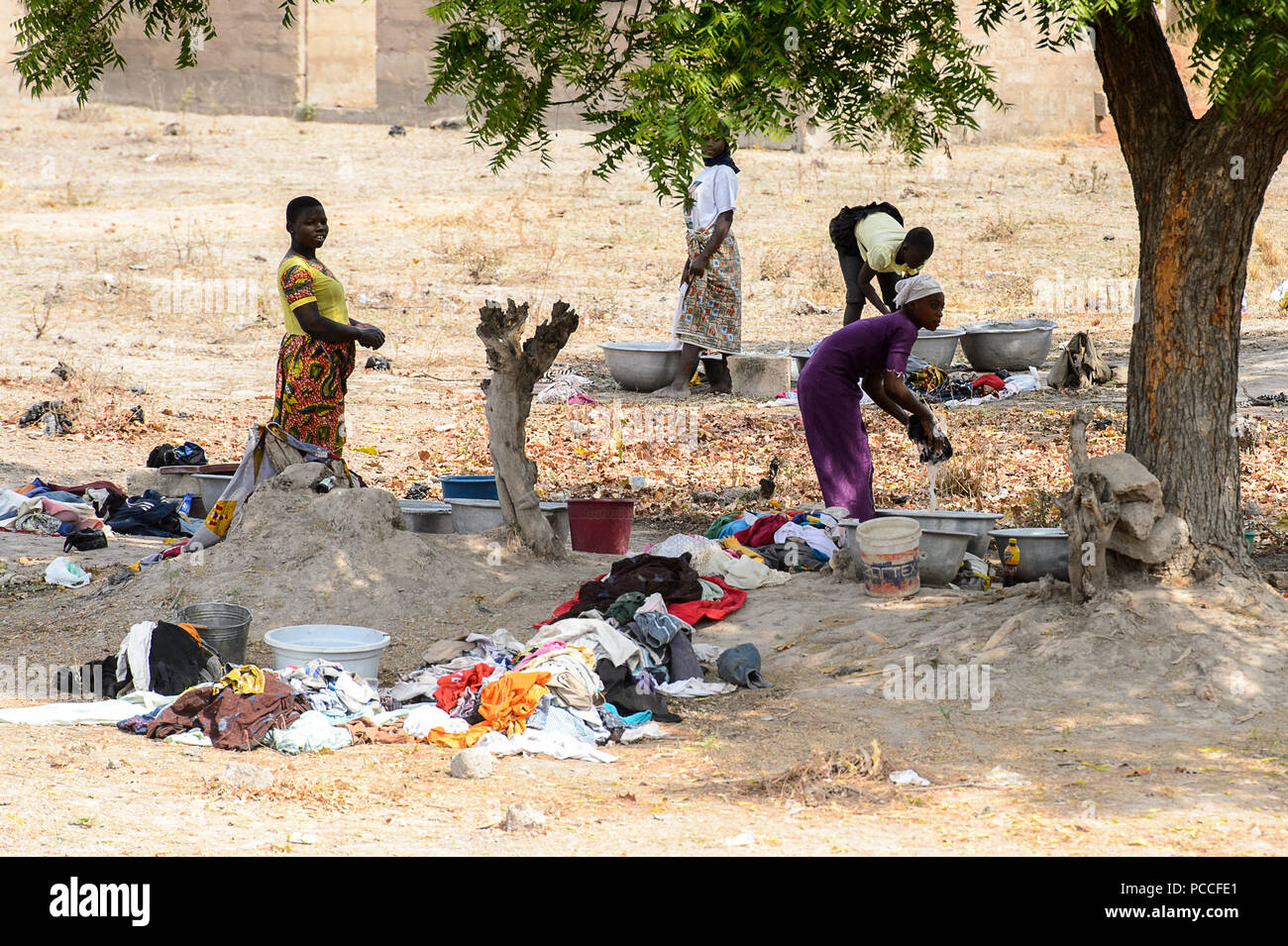 TECHIMAN, GHANA - JAN 15, 2017: Unidentified Ghanaian people clean the ...