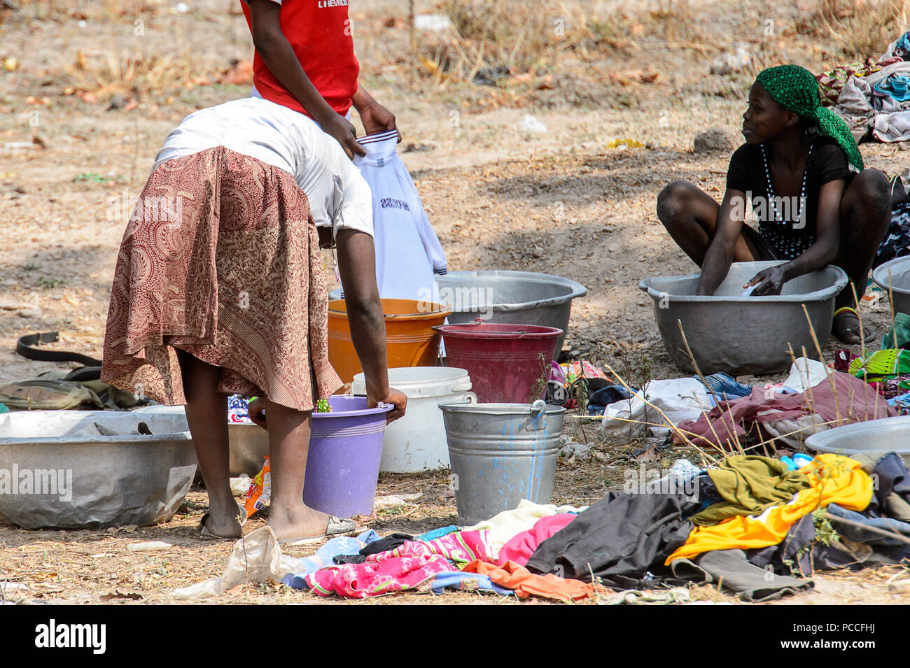 TECHIMAN, GHANA - JAN 15, 2017: Unidentified Ghanaian woman cleans the ...
