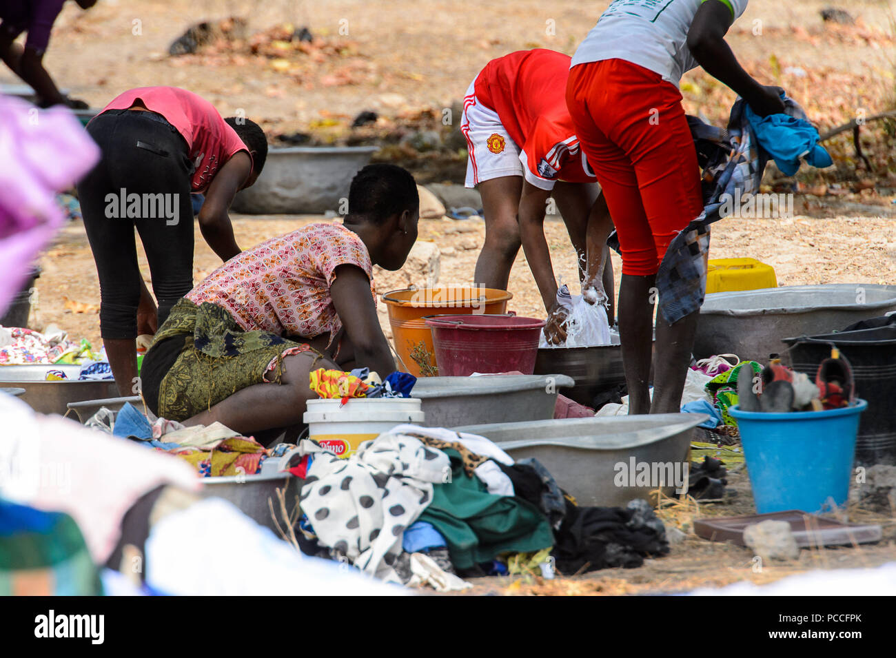 TECHIMAN, GHANA - JAN 15, 2017: Unidentified Ghanaian woman cleans ...