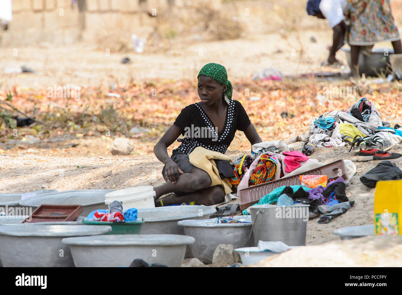 TECHIMAN, GHANA - JAN 15, 2017: Unidentified Ghanaian woman cleans ...