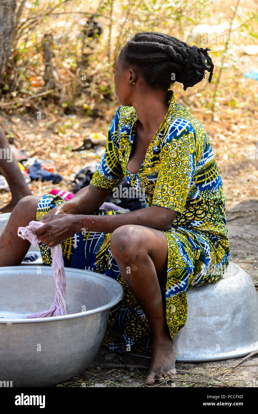 TECHIMAN, GHANA - JAN 15, 2017: Unidentified Ghanaian woman cleans ...