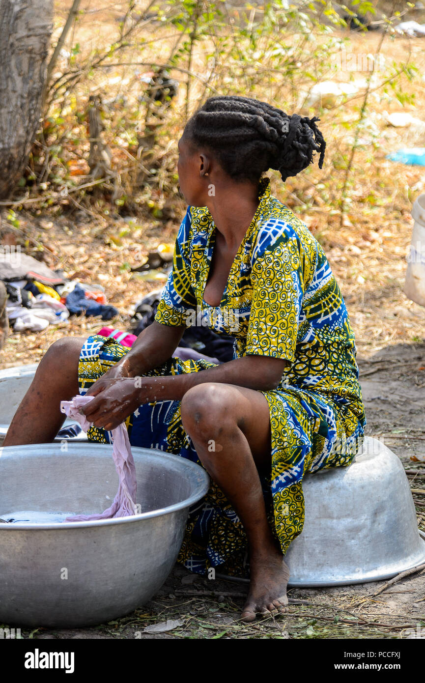 TECHIMAN, GHANA - JAN 15, 2017: Unidentified Ghanaian woman cleans ...