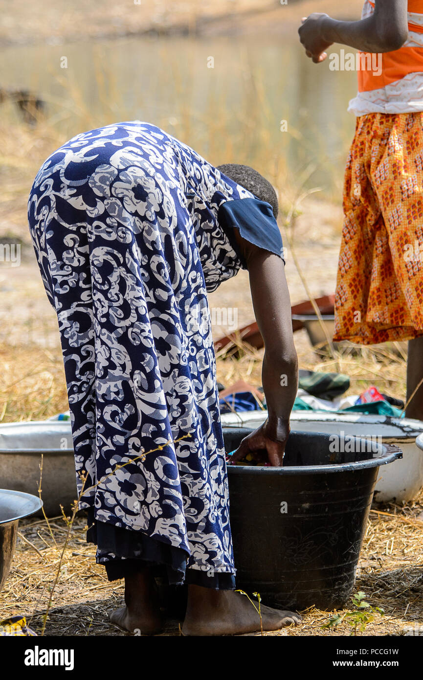 TECHIMAN, GHANA - JAN 15, 2017: Unidentified Ghanaian woman cleans ...