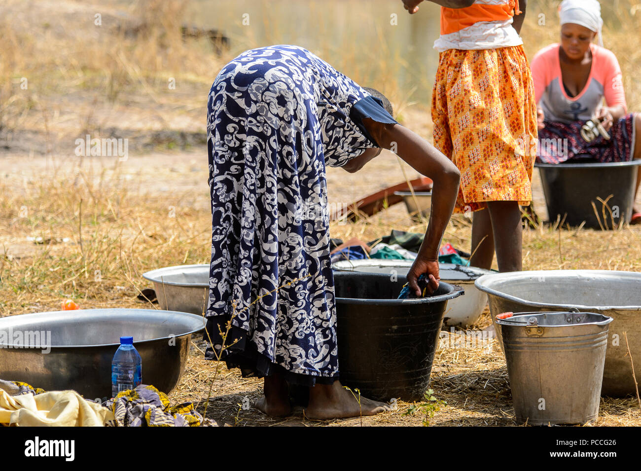 TECHIMAN, GHANA - JAN 15, 2017: Unidentified Ghanaian woman cleans ...