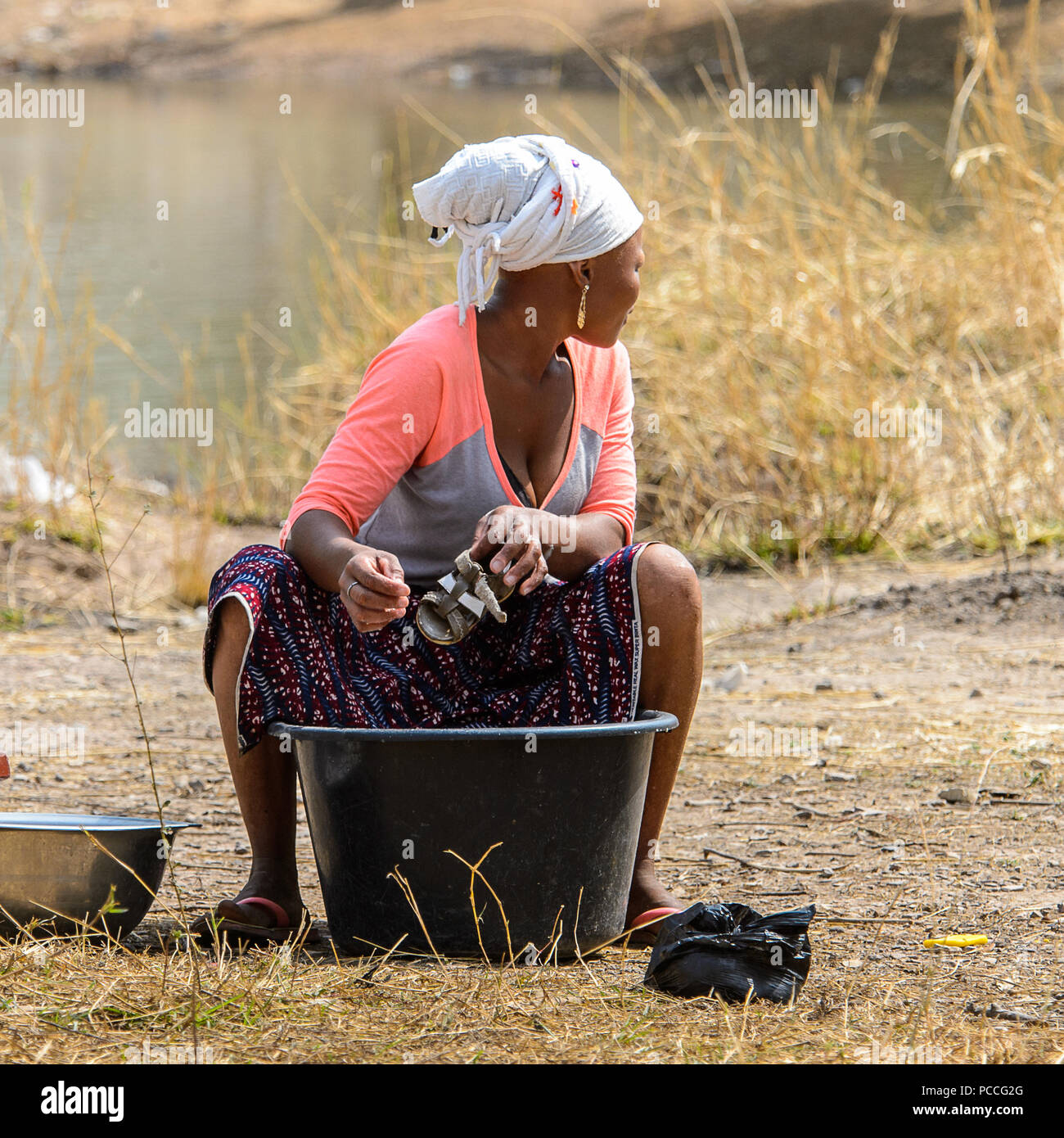 TECHIMAN, GHANA - JAN 15, 2017: Unidentified Ghanaian woman cleans ...