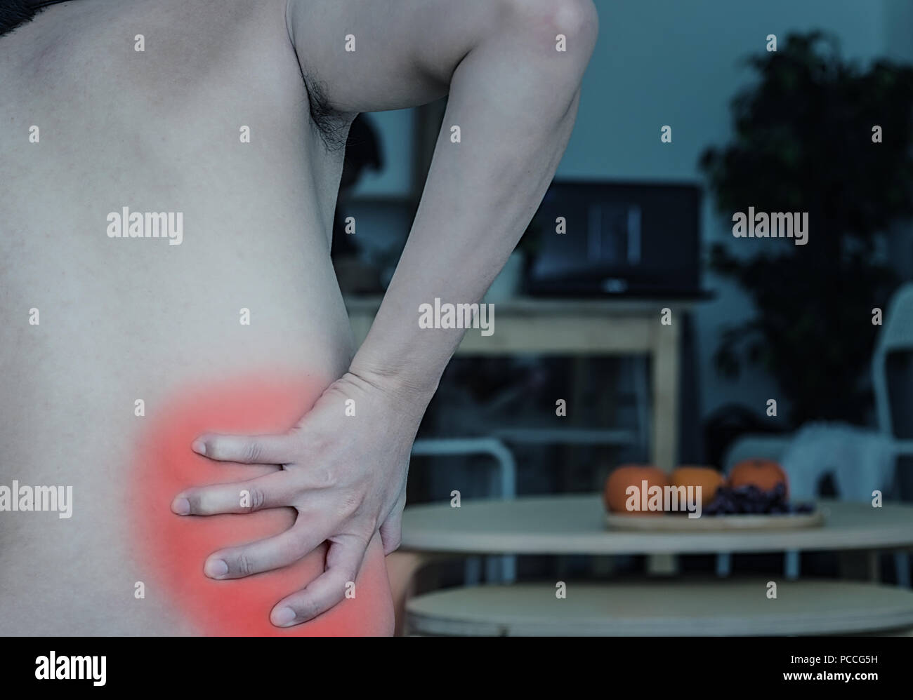 Asian man back pain and sit on bed in bedroom in the morning.color tone ...