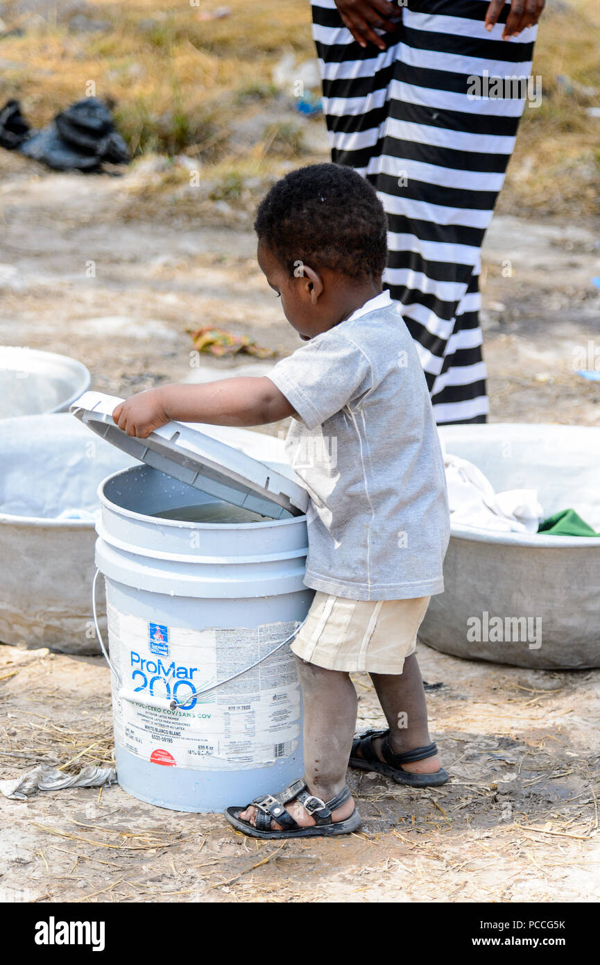 TECHIMAN, GHANA - JAN 15, 2017: Unidentified Ghanaian little boy opens ...