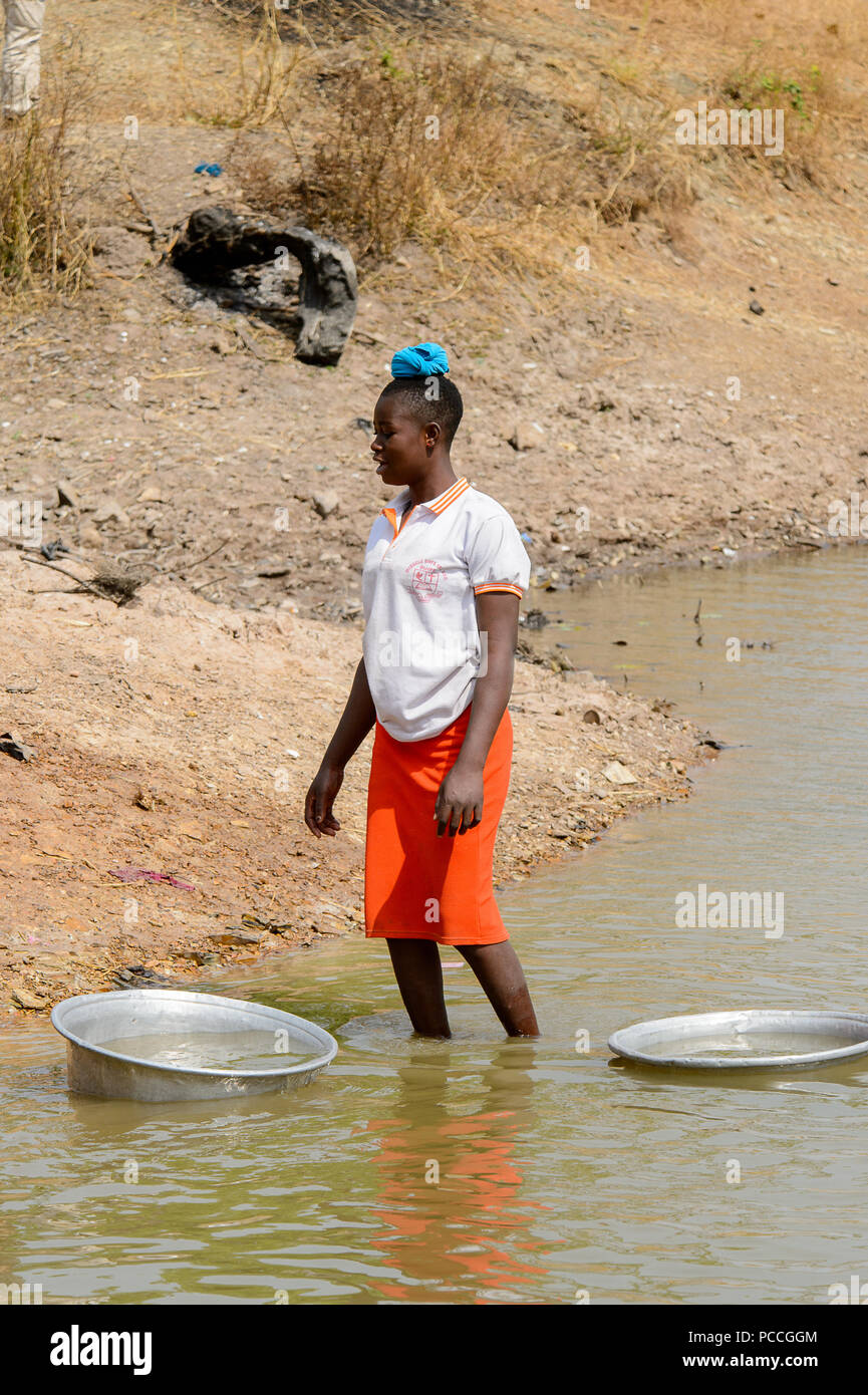 TECHIMAN, GHANA - JAN 15, 2017: Unidentified Ghanaian woman gets water ...