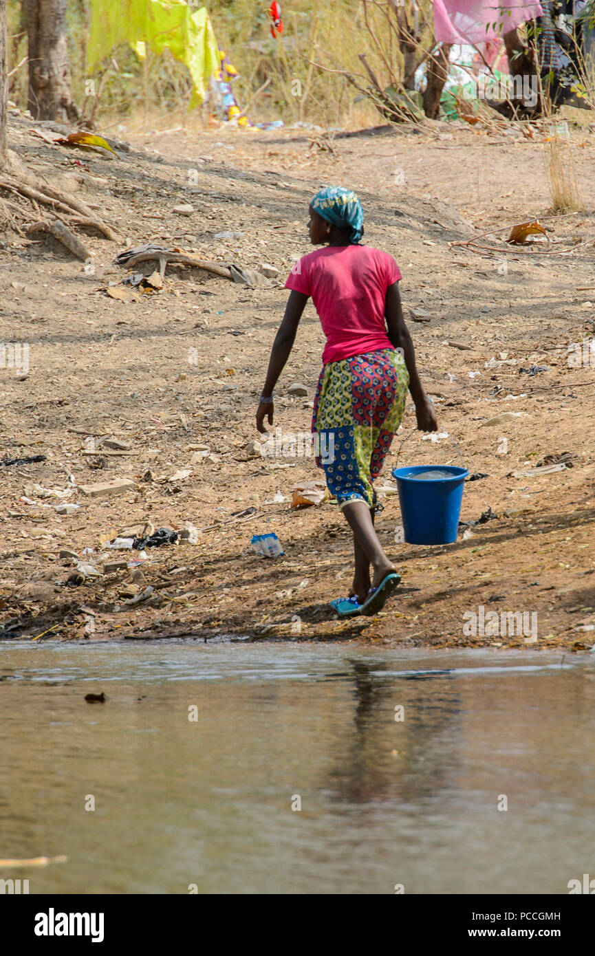 TECHIMAN, GHANA - JAN 15, 2017: Unidentified Ghanaian woman carries a ...