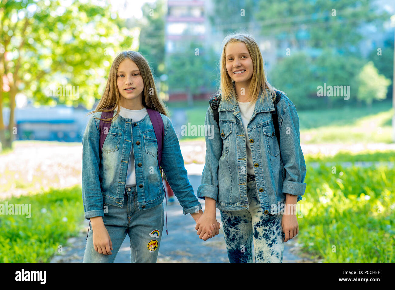Children hold each others hands hi-res stock photography and images - Alamy