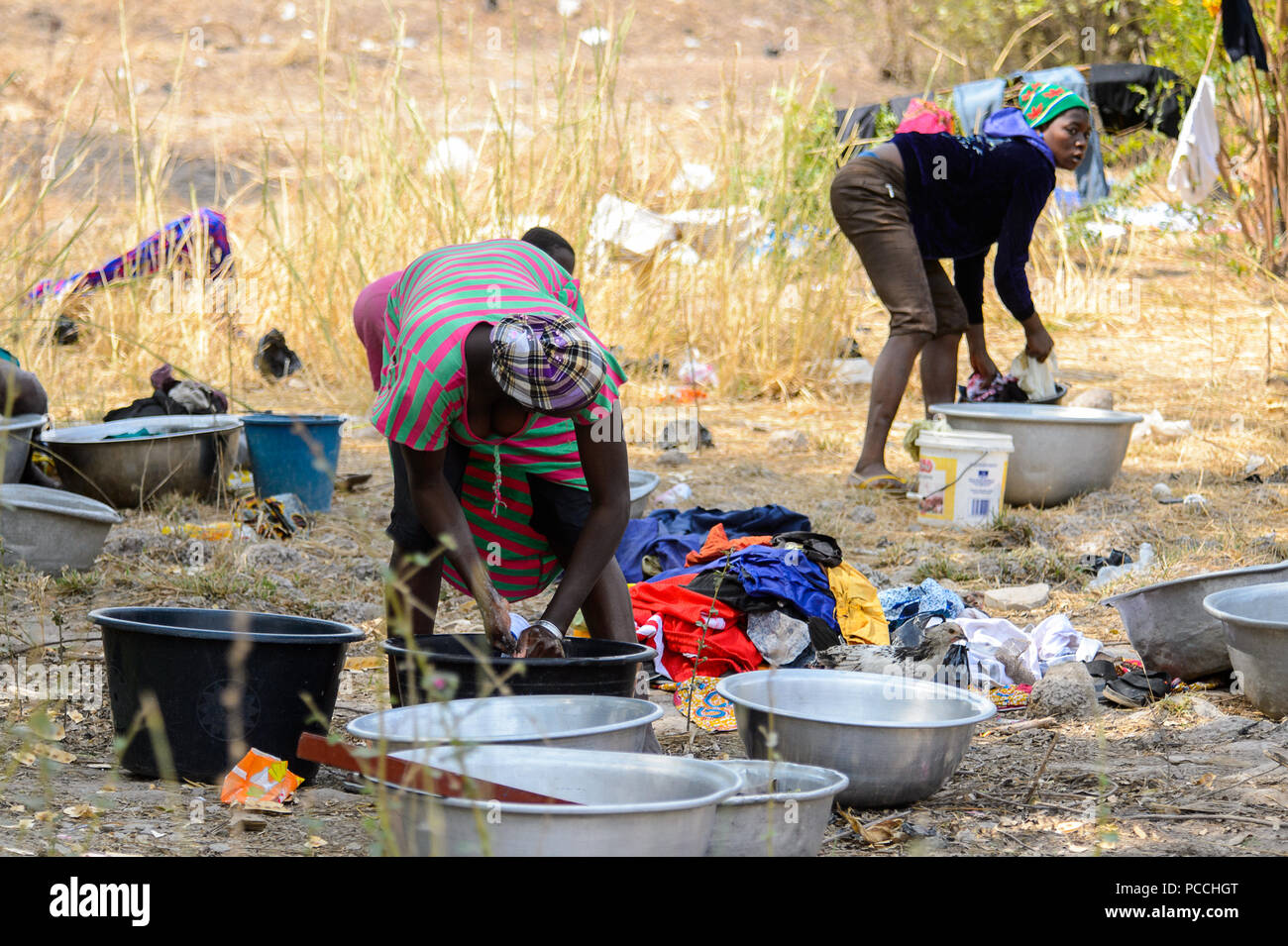 TECHIMAN, GHANA - JAN 15, 2017: Unidentified Ghanaian woman cleans ...