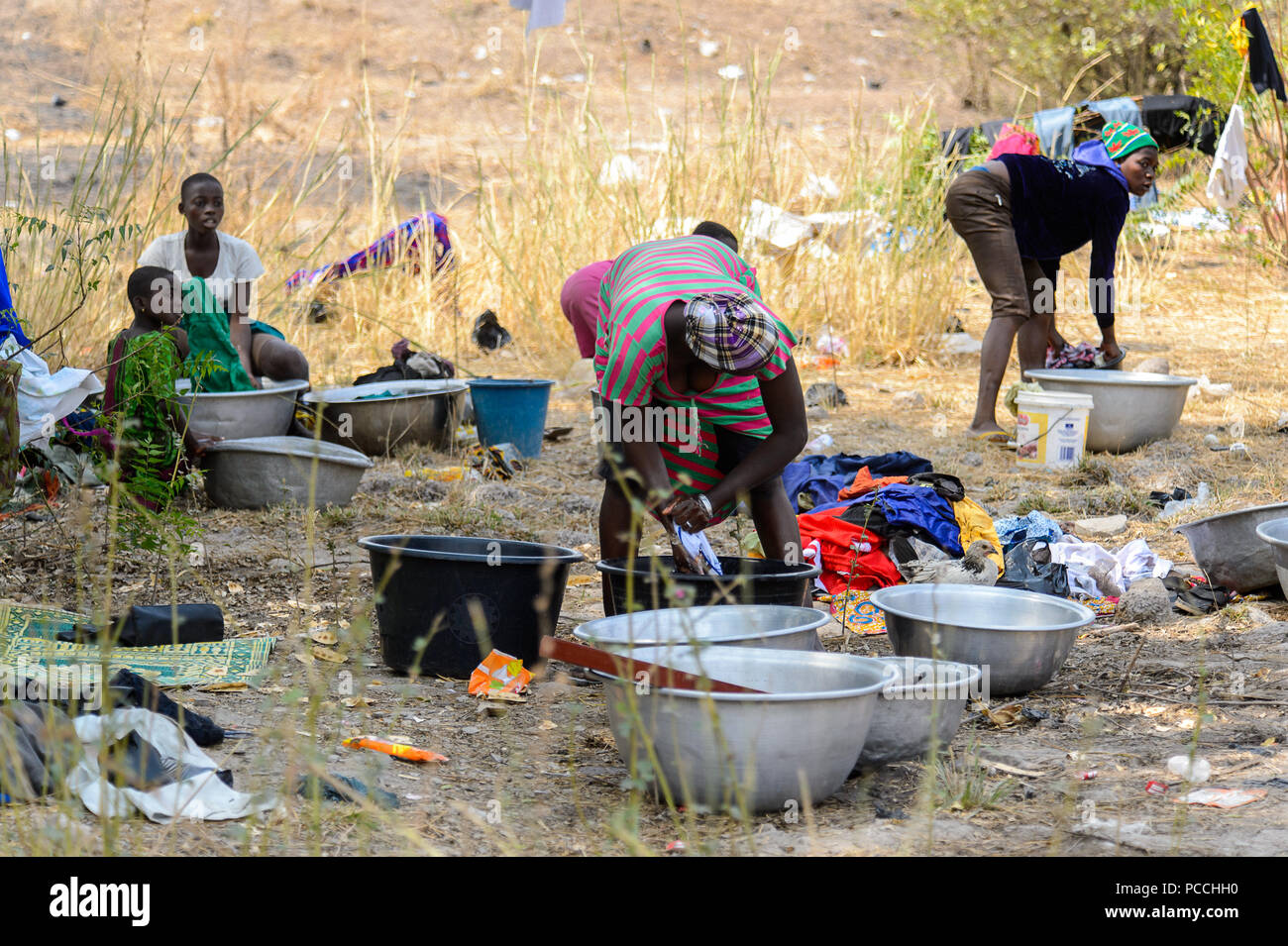 TECHIMAN, GHANA - JAN 15, 2017: Unidentified Ghanaian woman cleans ...