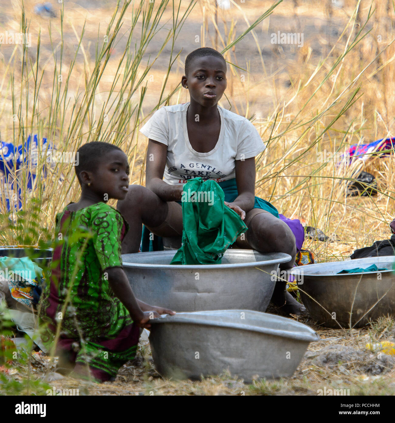 TECHIMAN, GHANA - JAN 15, 2017: Unidentified Ghanaian woman cleans ...