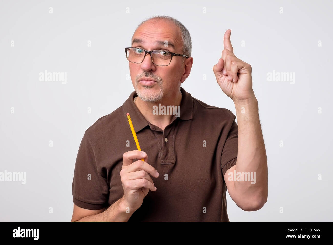 Pensive mature adult businessman brainstorming hi-res stock photography ...
