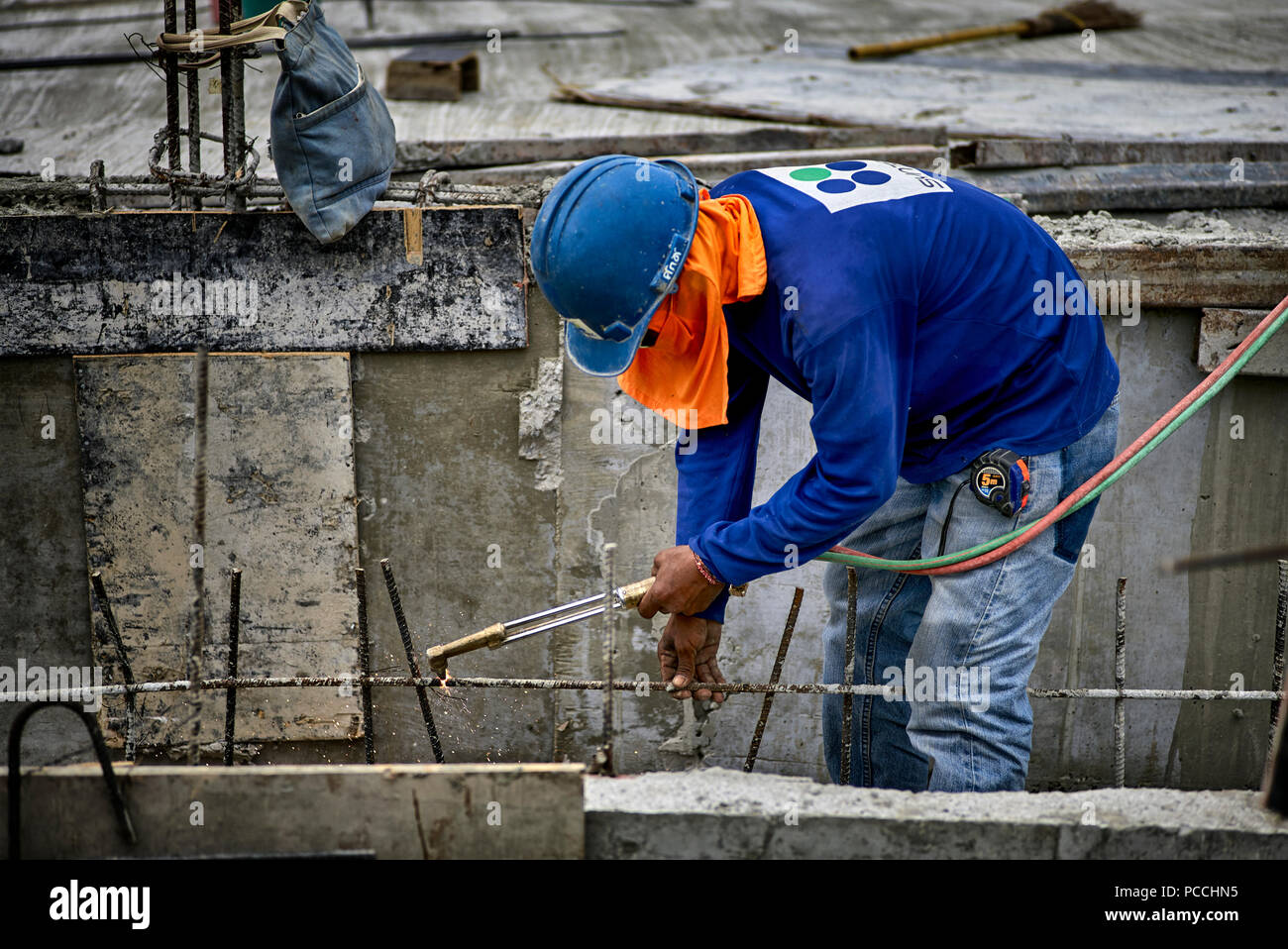 Builder using oxy acetylene torch on a construction site. Thailand ...