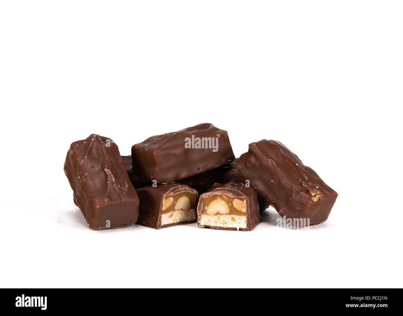 Medium Pile of Bite Sized Candy Bars on White Background Stock Photo ...