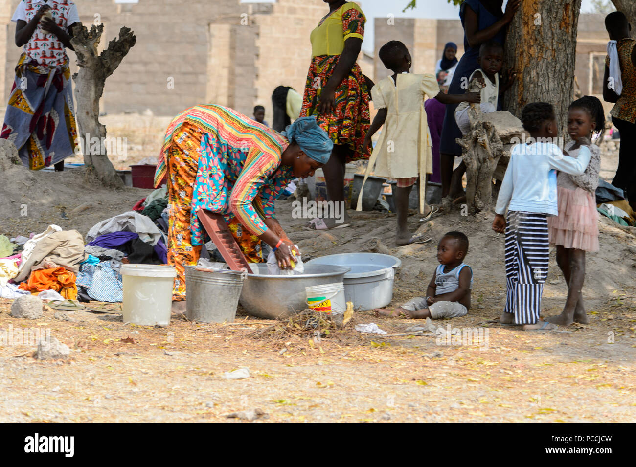 TECHIMAN, GHANA - JAN 15, 2017: Unidentified Ghanaian woman cleans ...