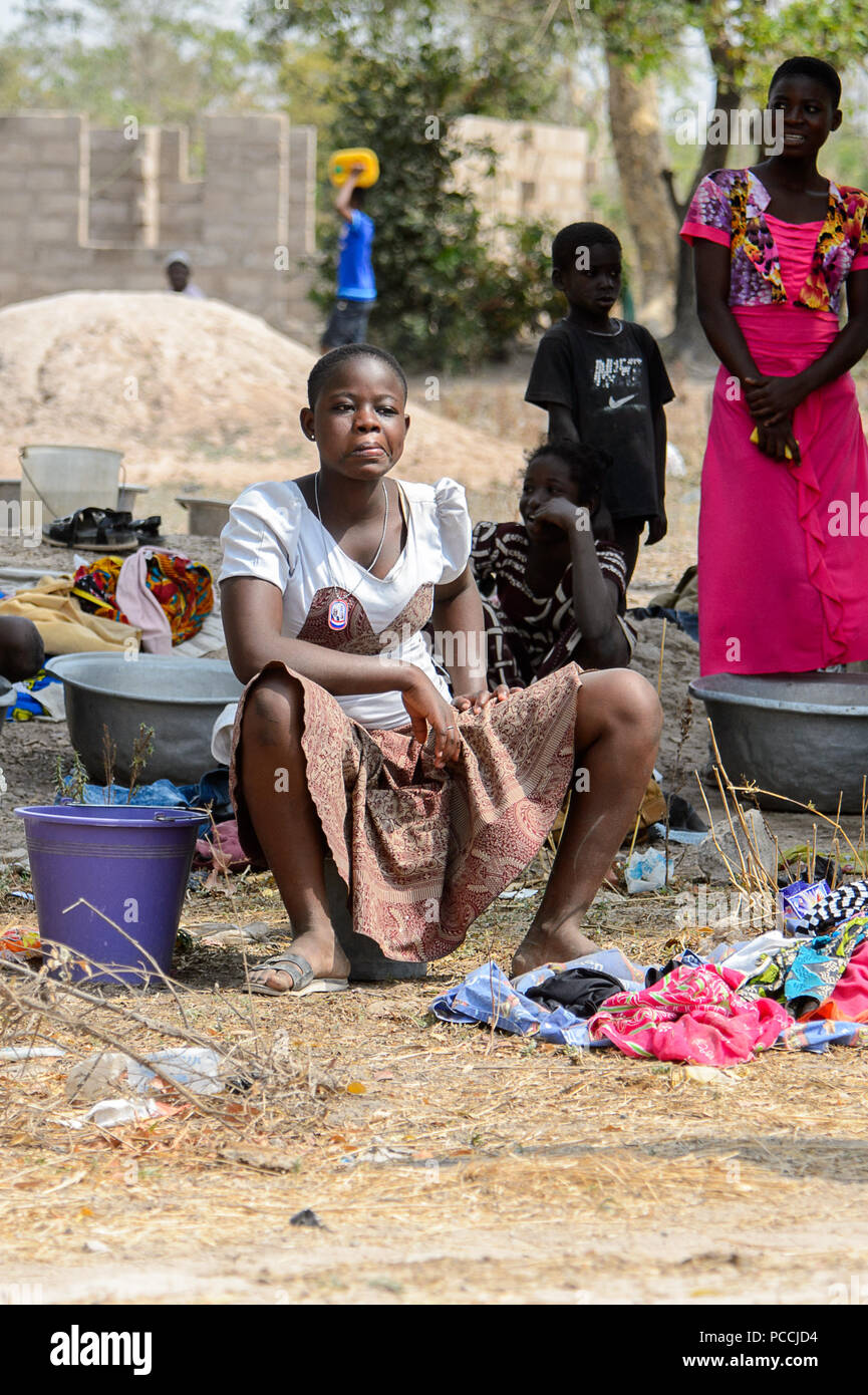 TECHIMAN, GHANA - JAN 15, 2017: Unidentified Ghanaian woman sits on a ...