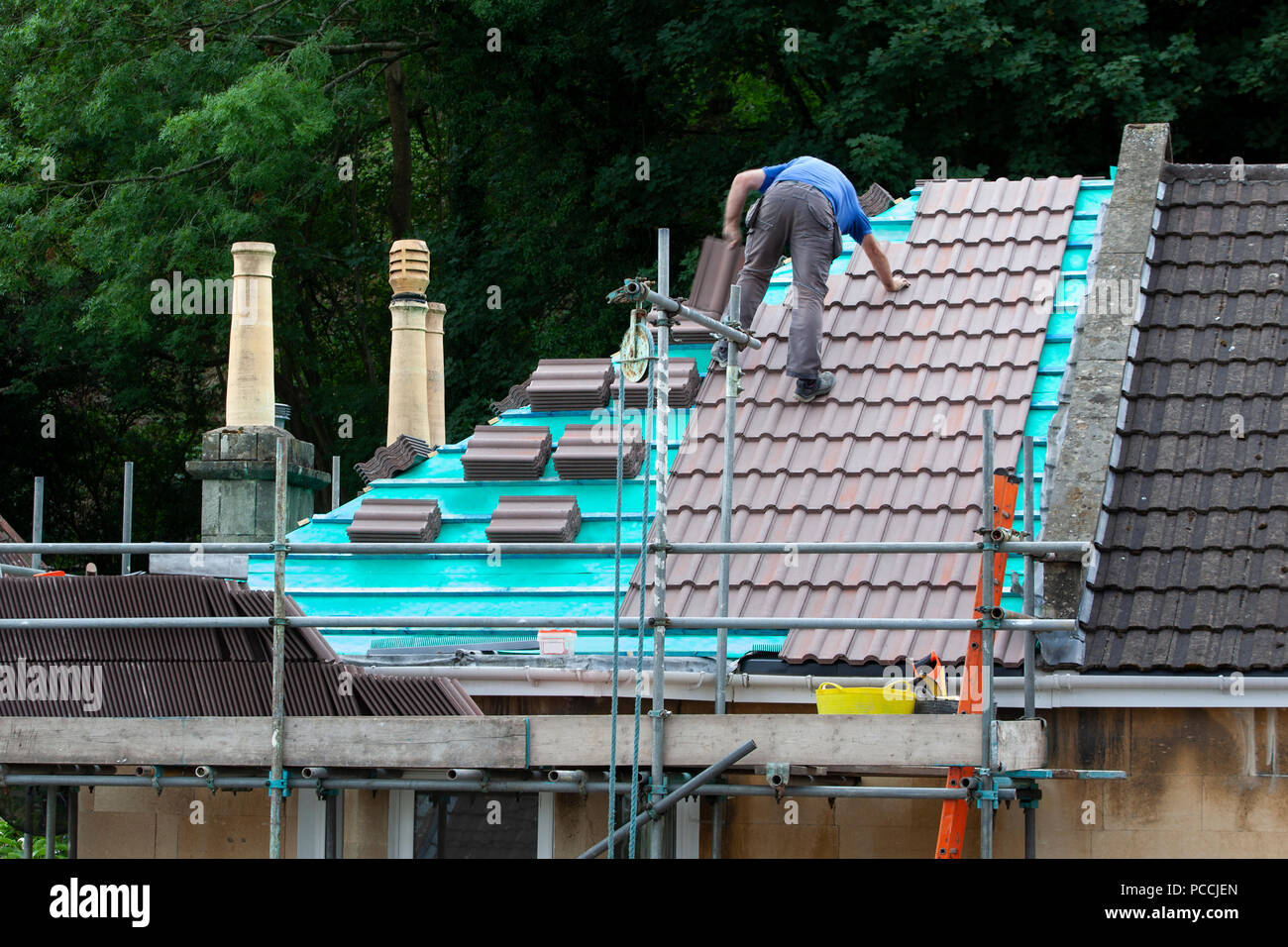 Laying roof tiles hi-res stock photography and images - Alamy