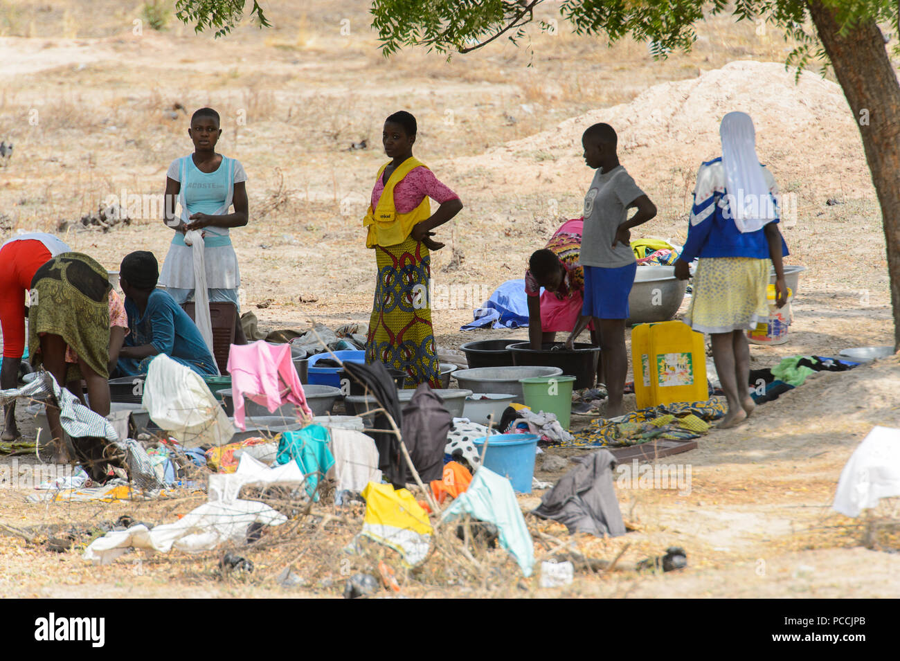TECHIMAN, GHANA - JAN 15, 2017: Unidentified Ghanaian people clean the ...