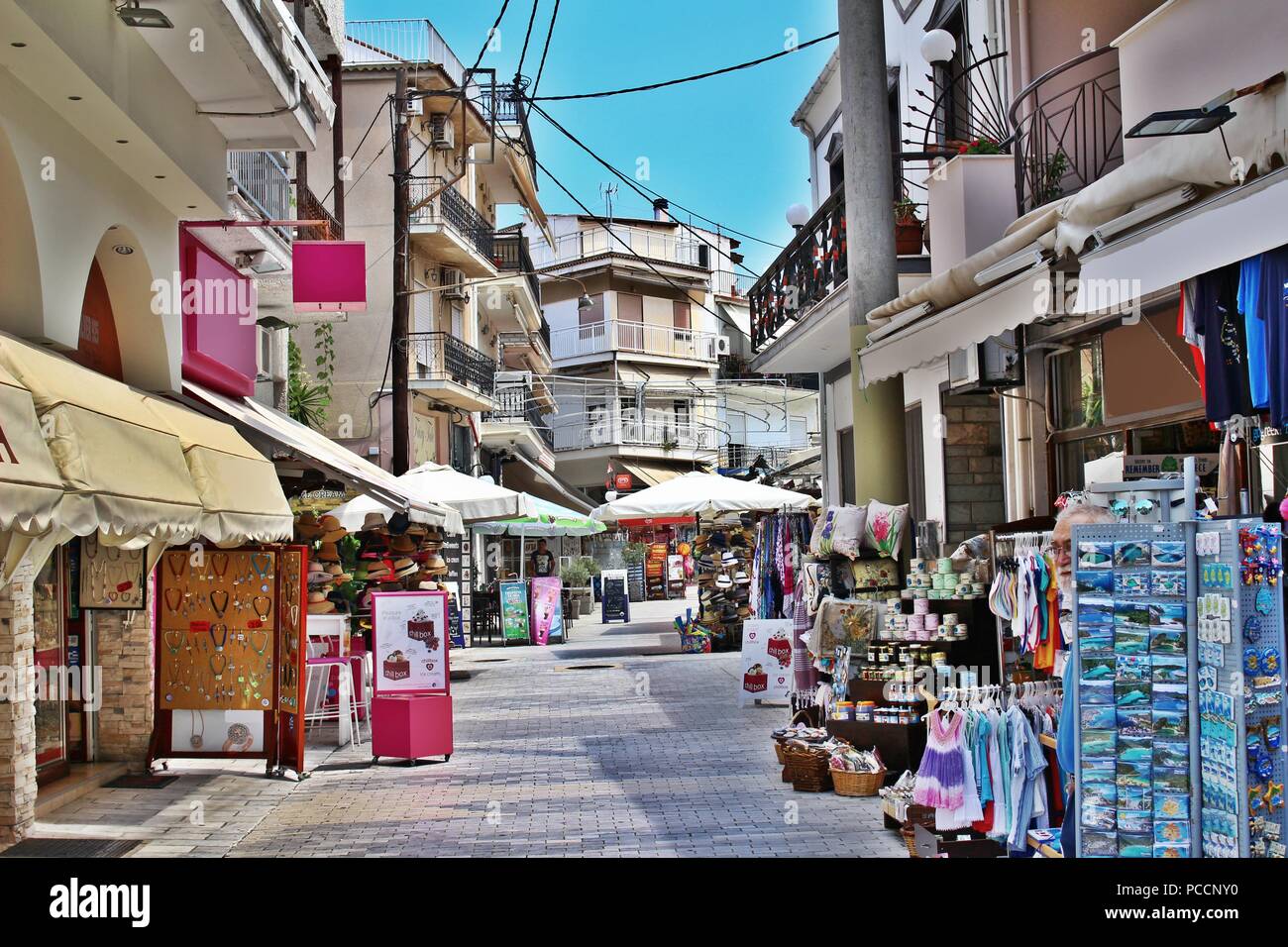 The main street in a Greek town with shops, cafes and restaurants Stock ...