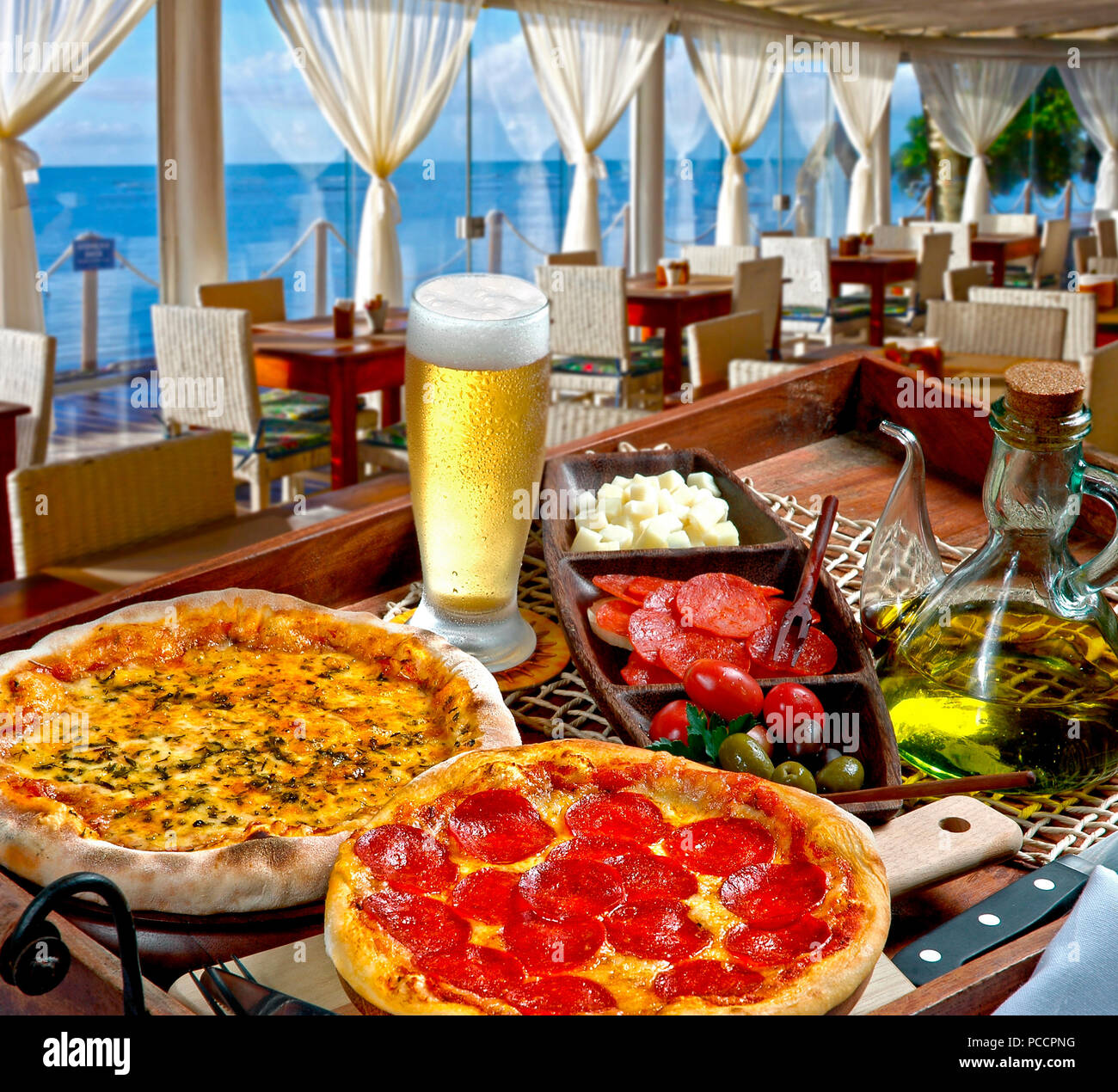 Pizzeria on the beach Stock Photo - Alamy