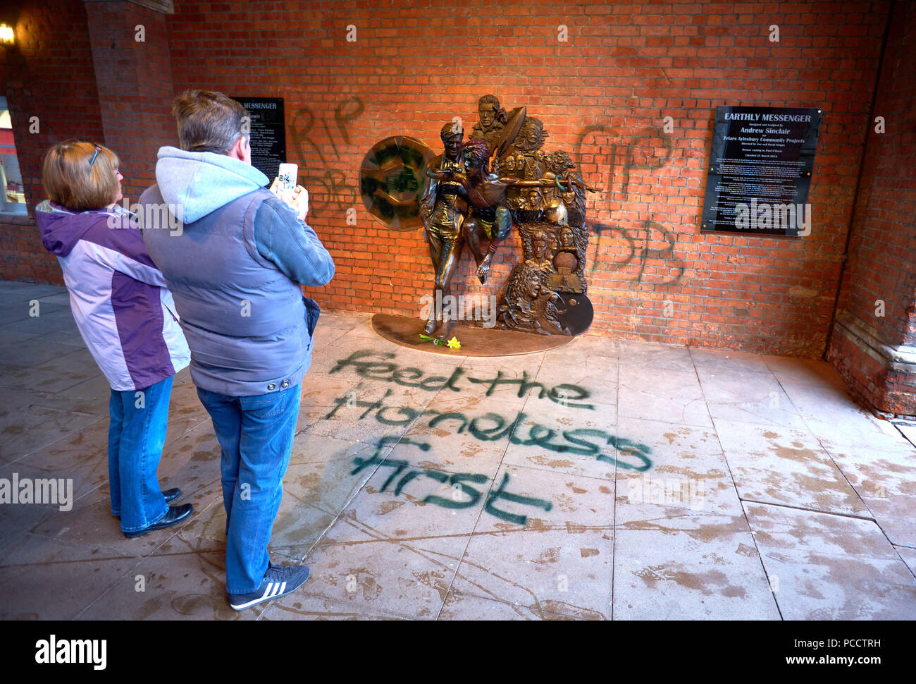 People look at the statue of David Bowie in Aylesbury after it was ...