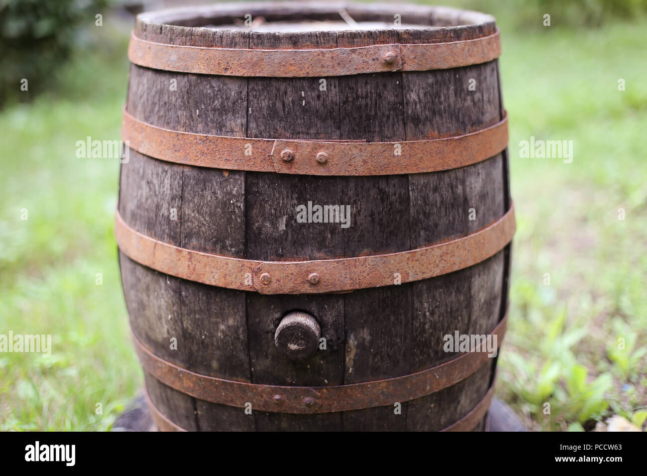 Rusty old barrel in the backyard of a rural house Stock Photo - Alamy
