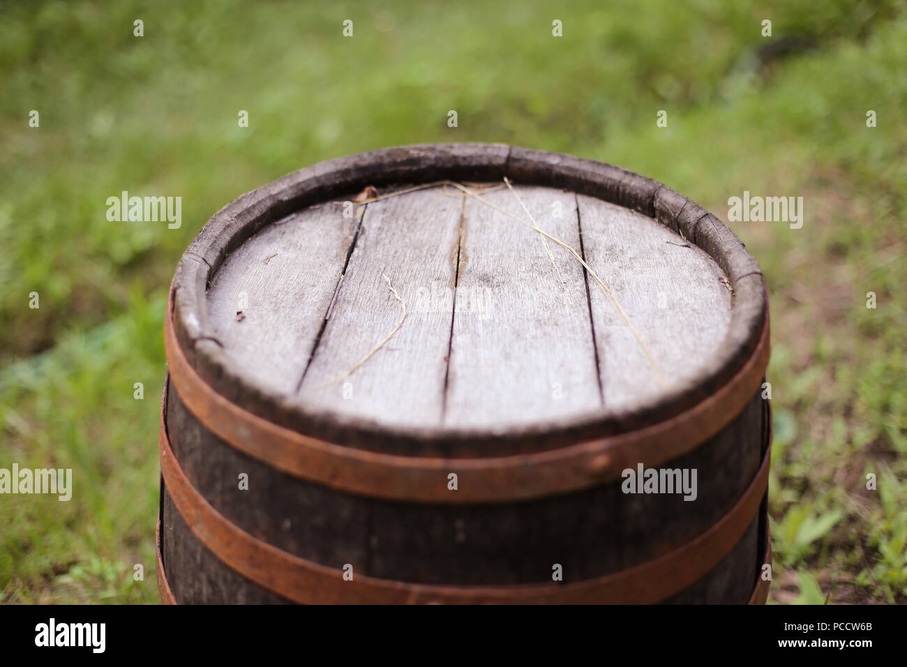 Rusty old barrel in the backyard of a rural house Stock Photo - Alamy