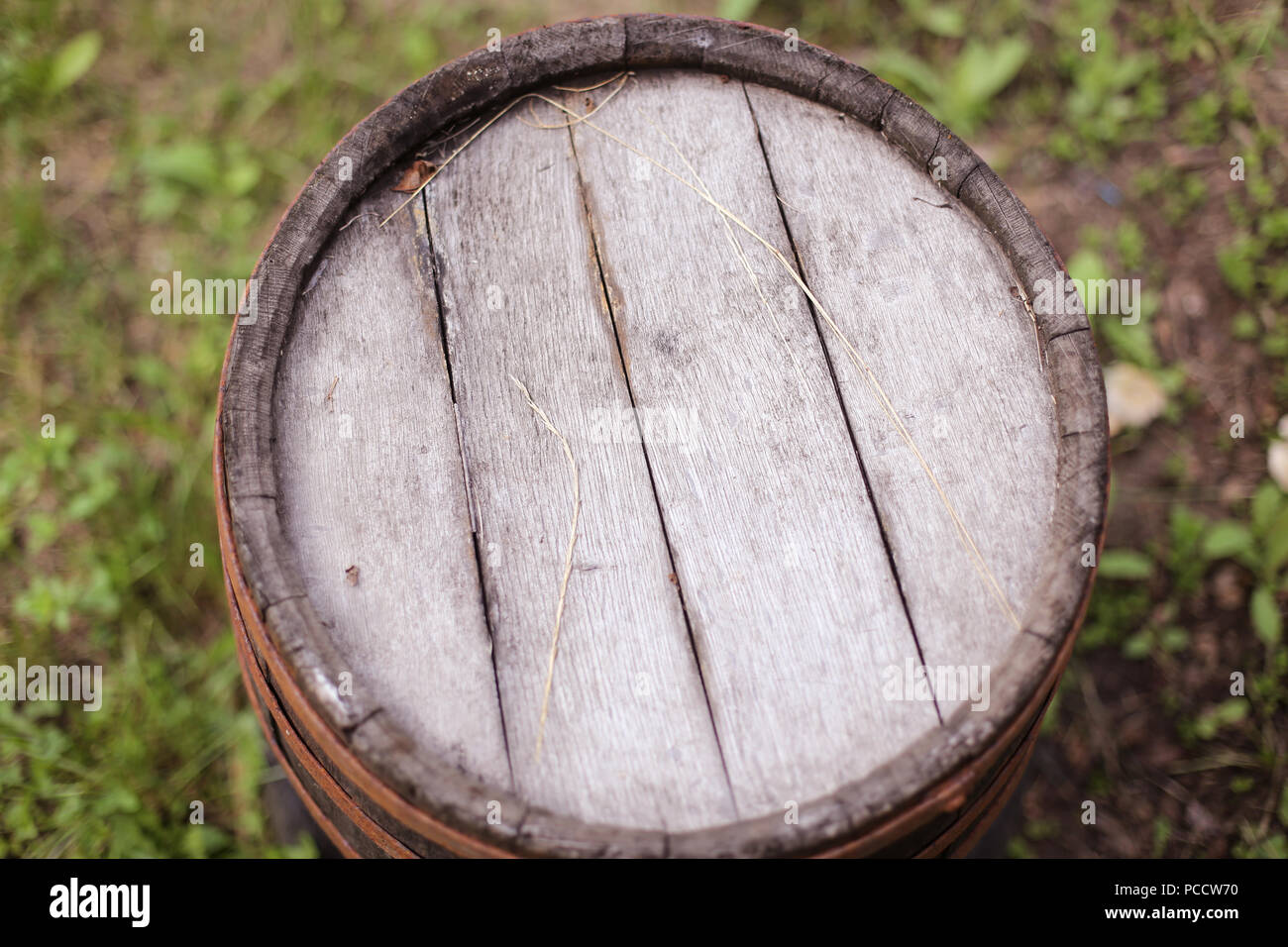 Rusty old barrel in the backyard of a rural house Stock Photo - Alamy