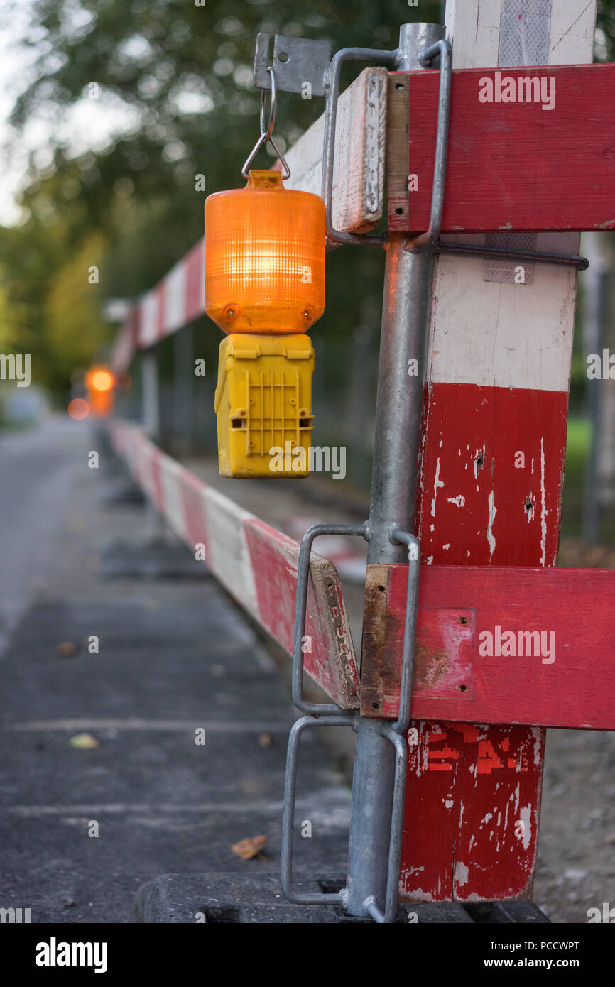 construction site with warning light on road close up Stock Photo - Alamy