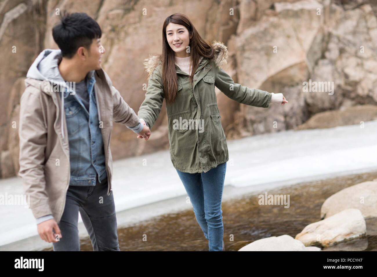 Happy young Chinese couple enjoying winter outing Stock Photo - Alamy